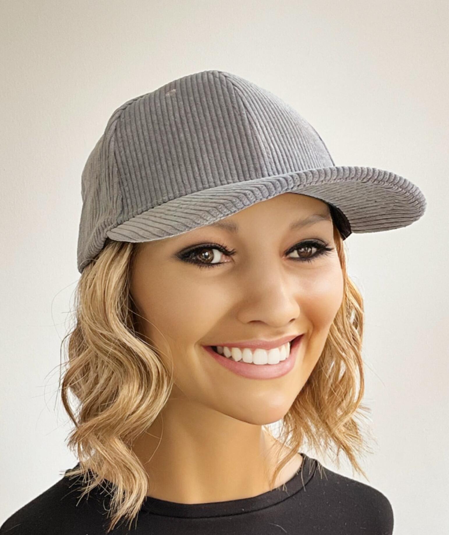 X grey cord cap with short wavy oats hair