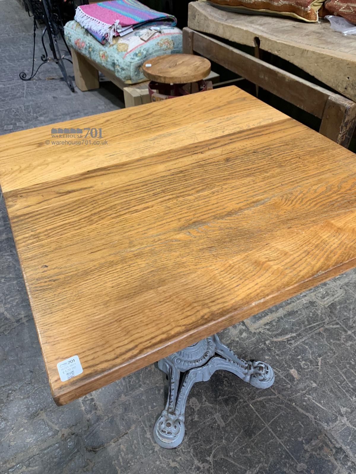 Reclaimed table with grey cast iron leg