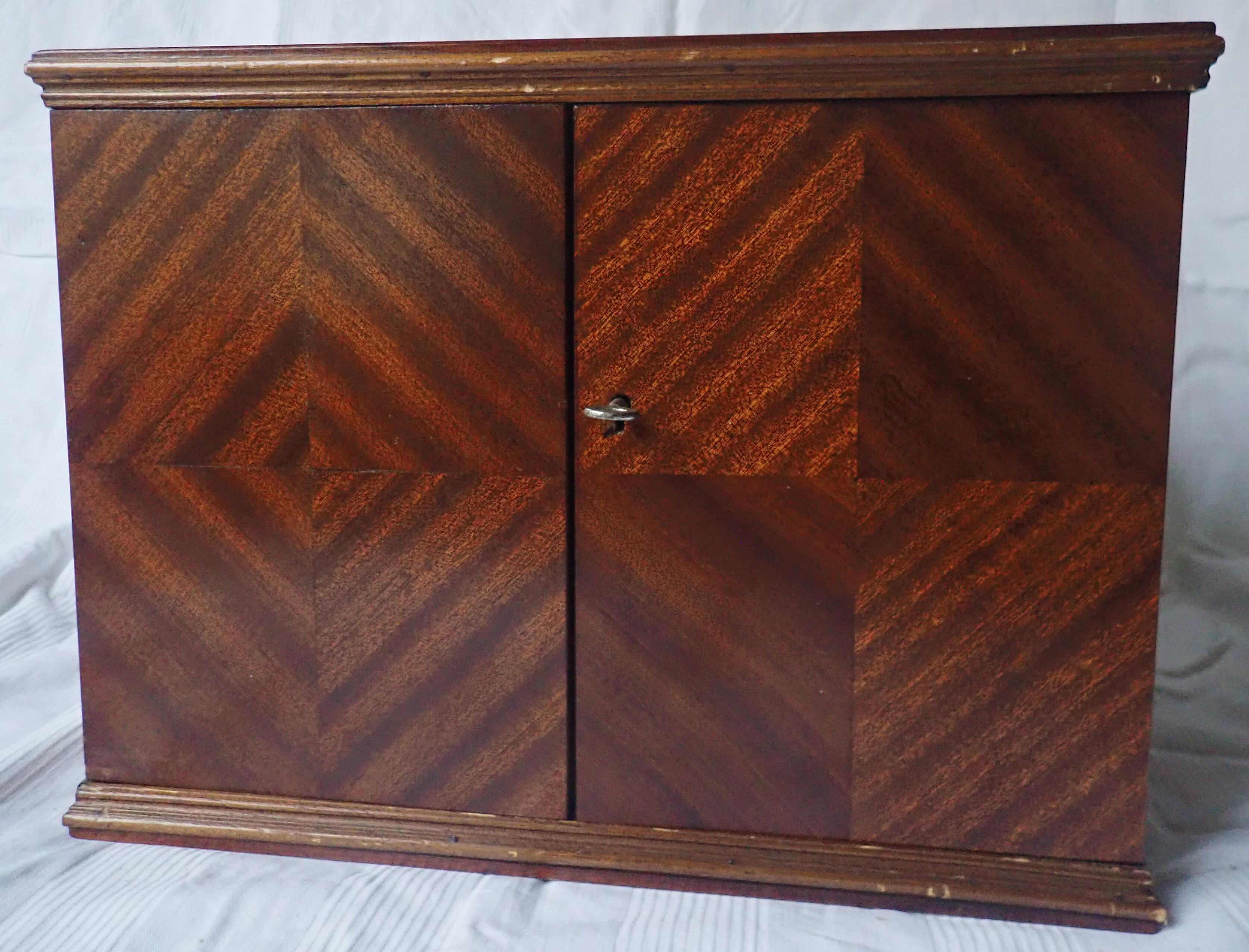 Modern mahogany coin cabinet