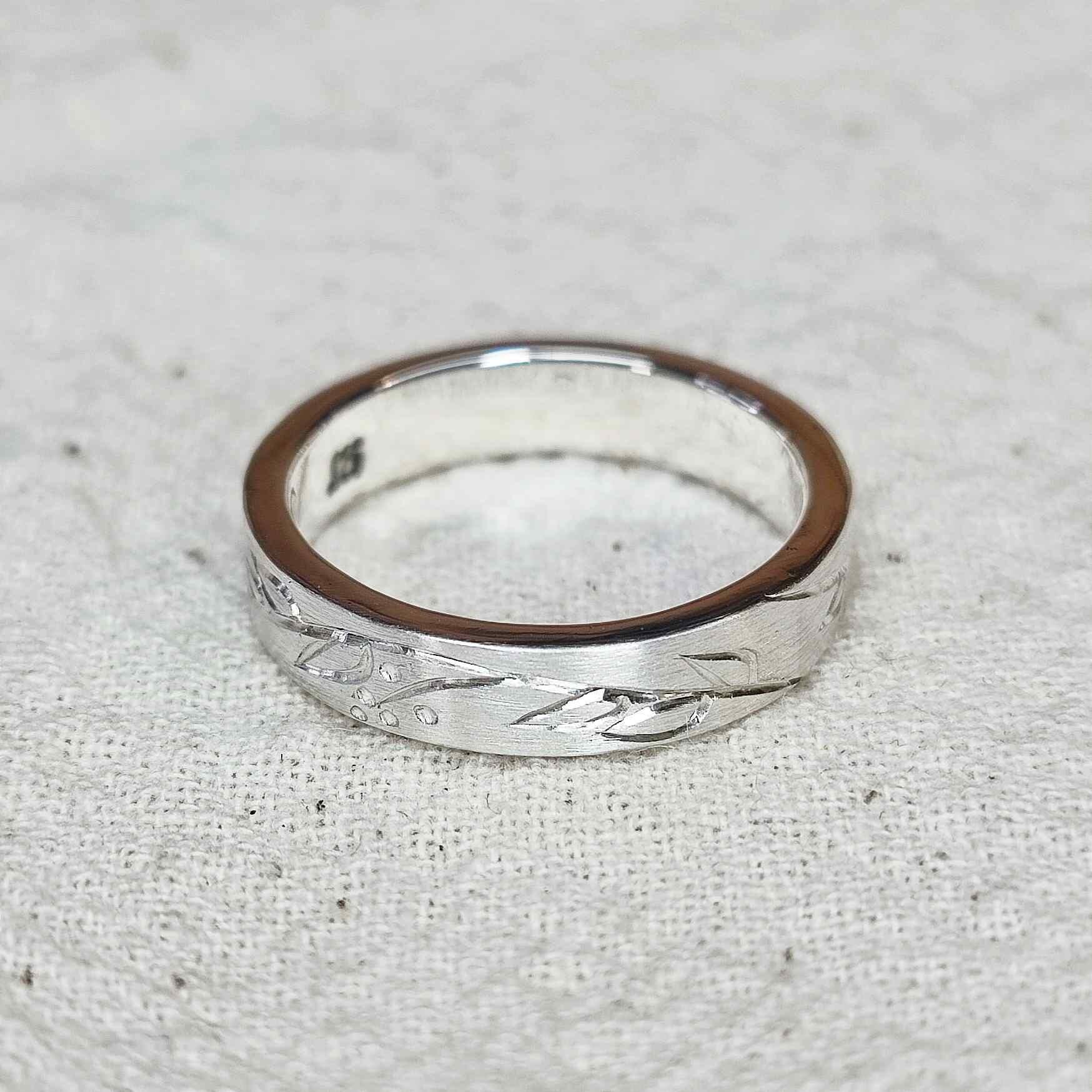 Hand engraved sterling silver floral band with brush finish