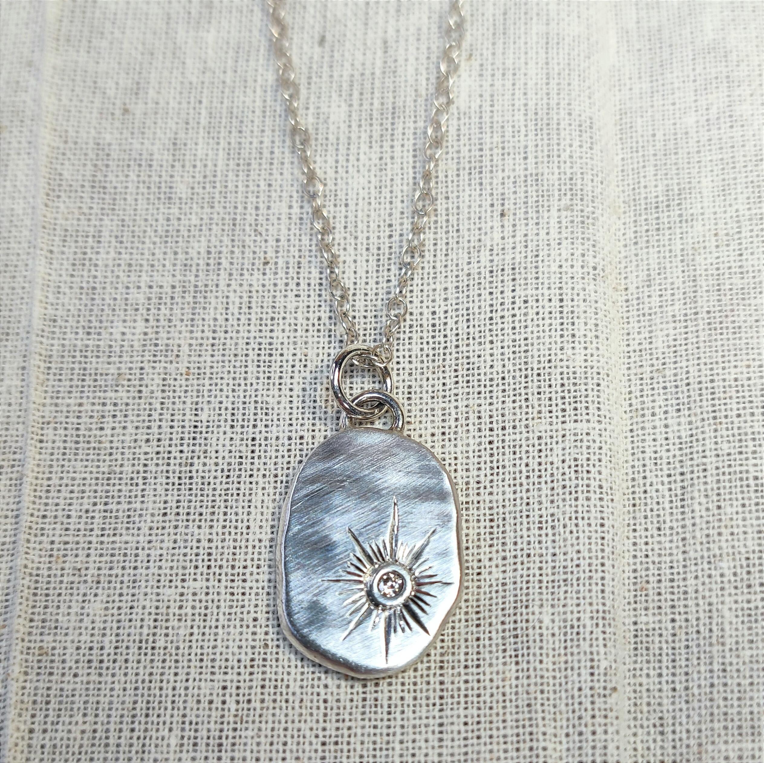 Pebble Pendant with hand engraved Sun design and 2mm Cubic Zirconia ...