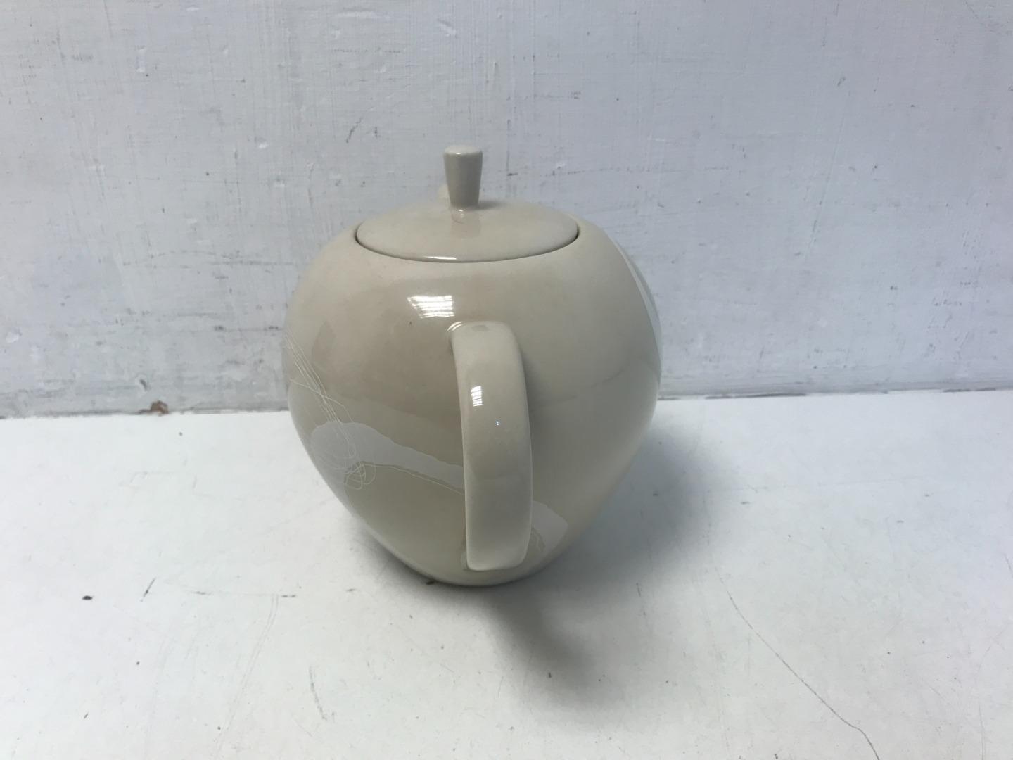 Rocha John Rocha Knot Teapot with Cups and Saucers