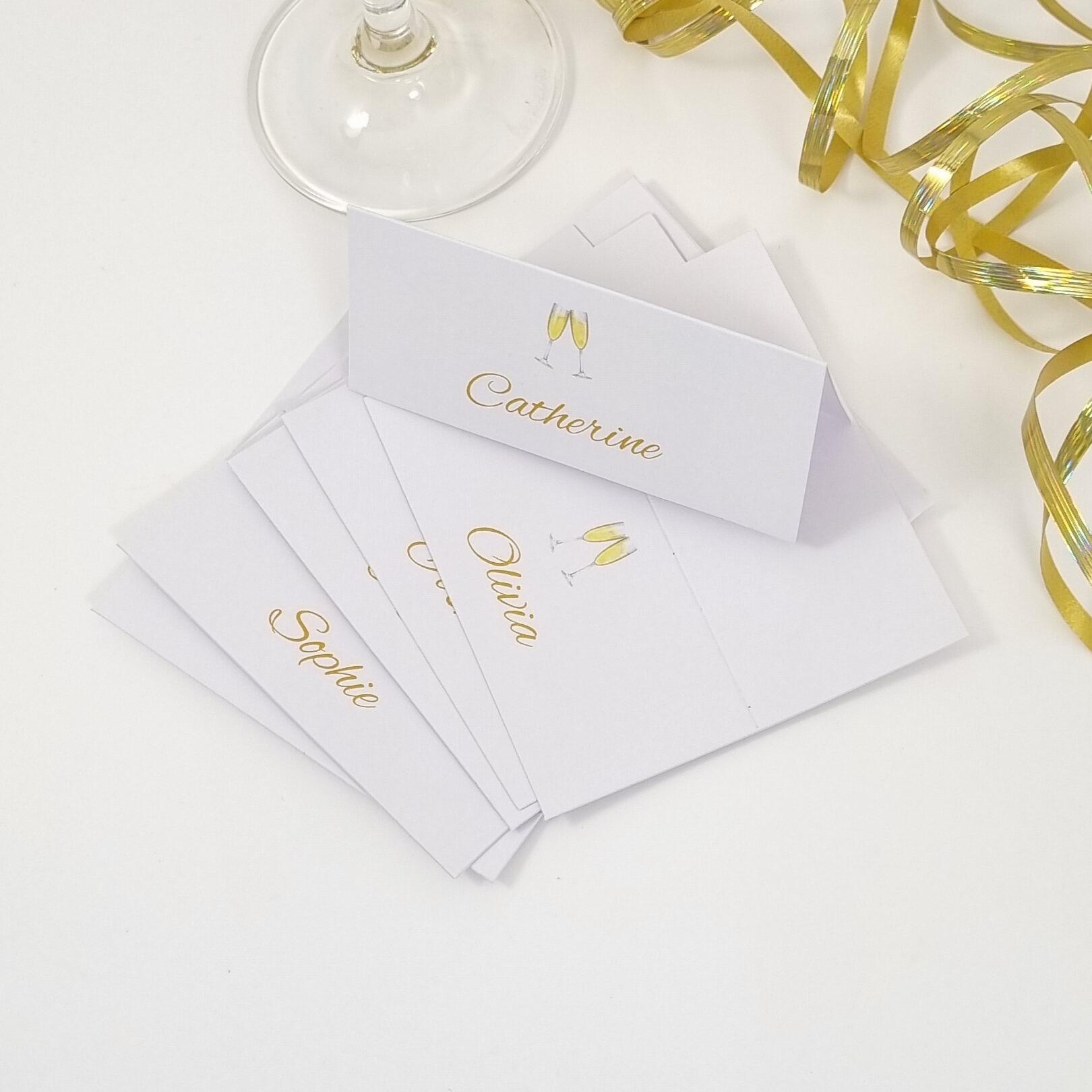 Place Cards With A Printed Pair of Champagne Glasses and Guest Names ...