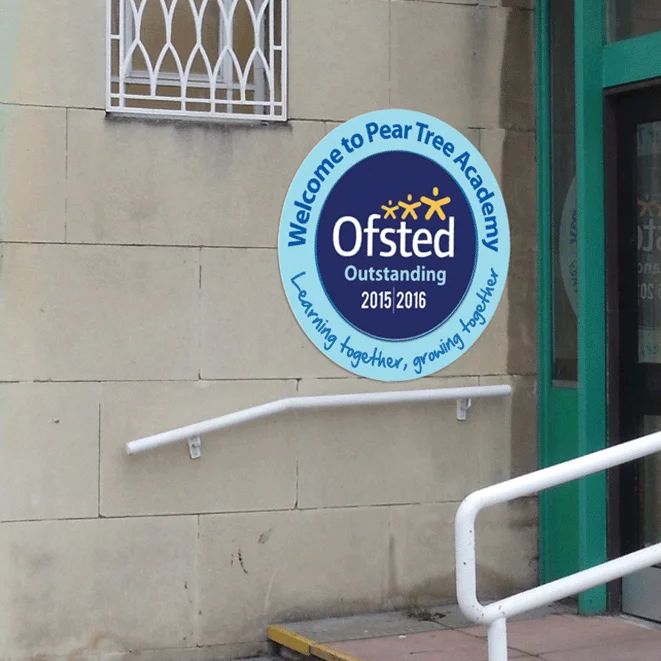 Circular Welcome Sign Featuring Ofsted Logo and Grading
