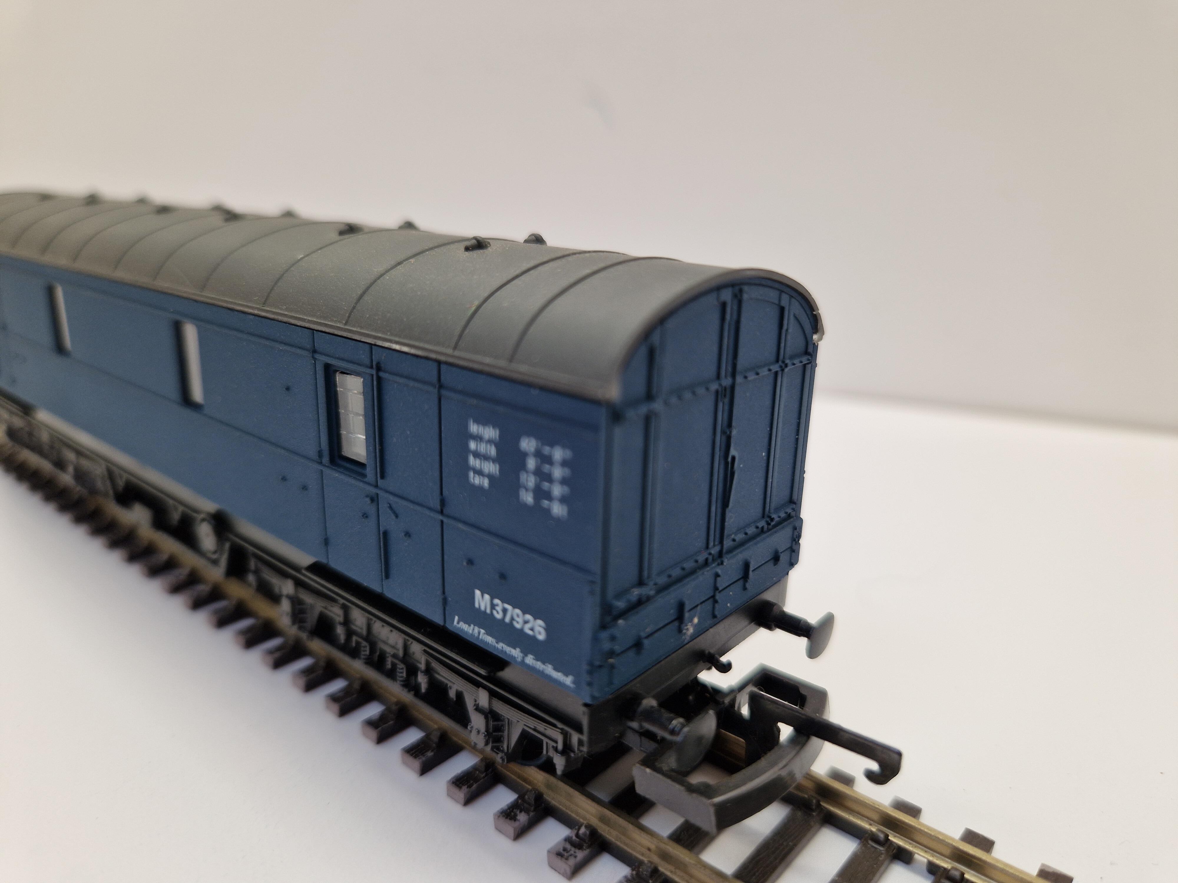 A pre-owned LIMA 305360W Ex LMS 42' GUV bogie parcels van in BR Blue