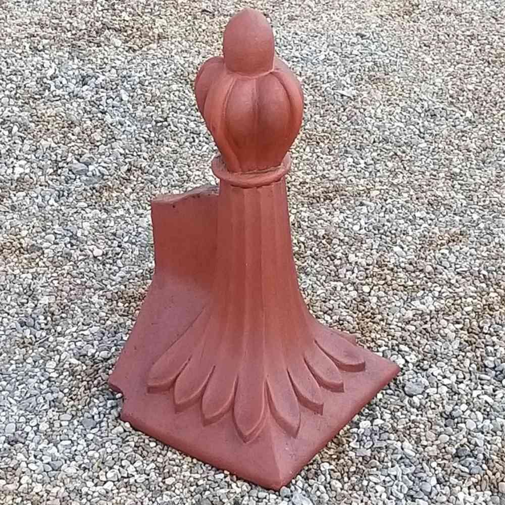 Angled block end coronation crest ridge finial