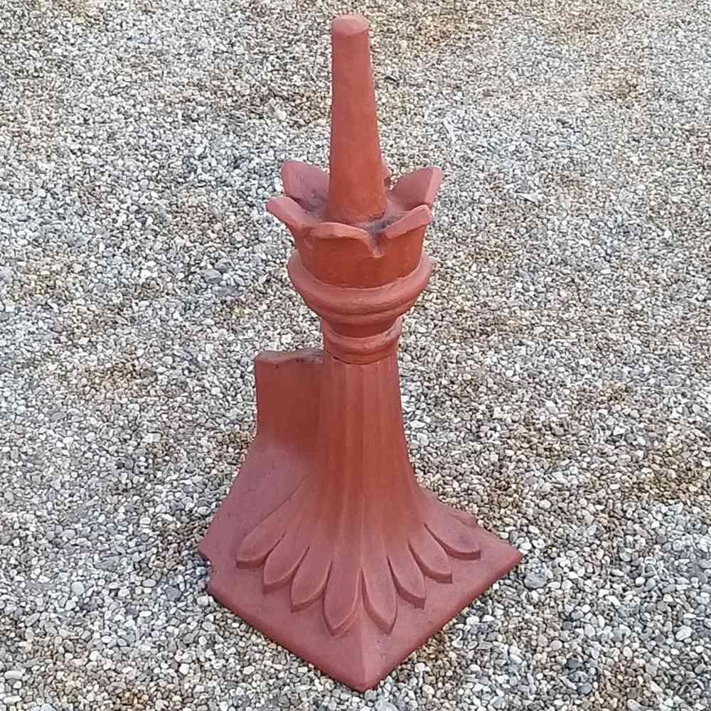 Angled block end crown finial