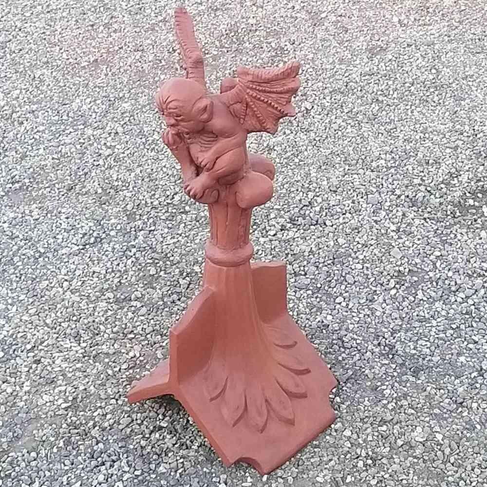 Column poking tongue gargoyle finial