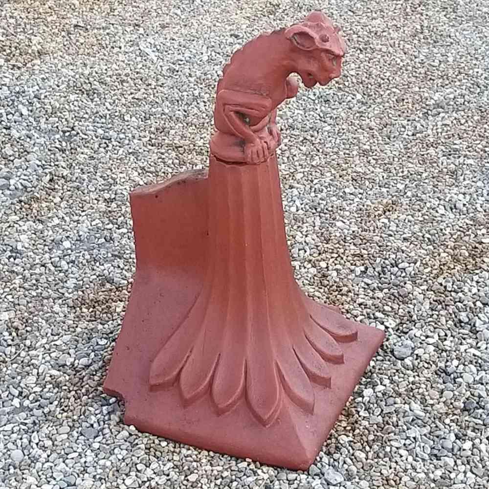 Angled block end horned gargoyle roof finial