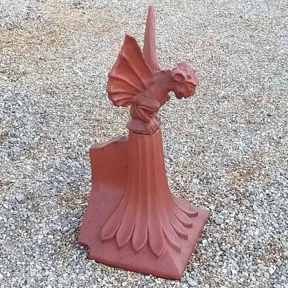 Angled block end winged gargoyle finial