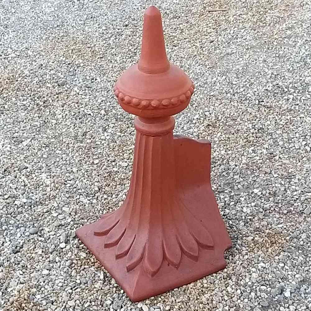 Angled block end topper roof finial